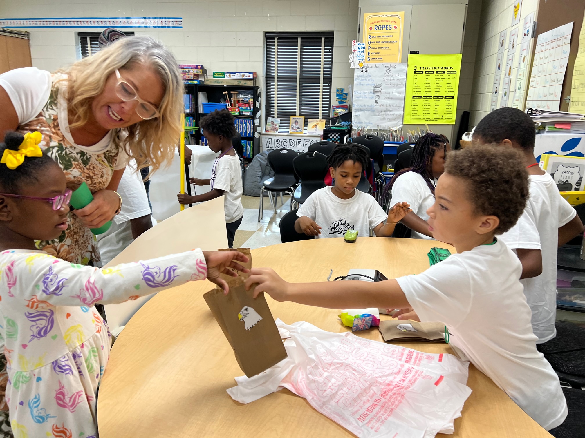 First graders learn about economics by operating a store in their ...